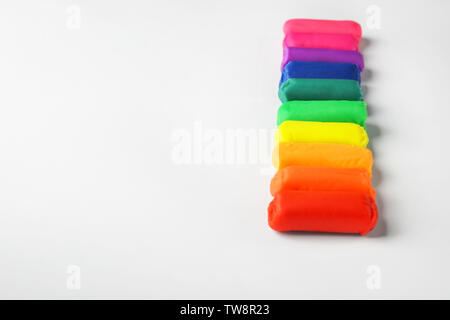 Rainbow play dough on white background Stock Photo - Alamy