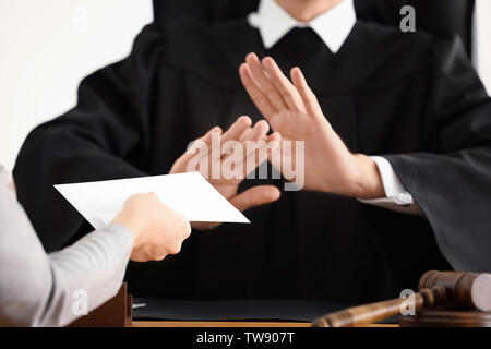 Male judge refusing to take bribe from woman, closeup Stock Photo - Alamy
