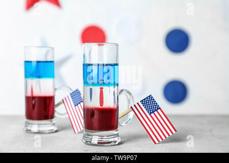 Layered cocktails in colors of American flag on table Stock Photo - Alamy