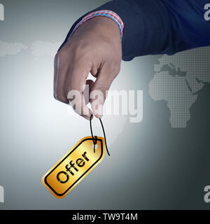 Smart hand showing offer tag Stock Photo - Alamy