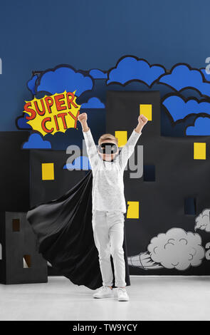 Cute boy as superhero against decoration. Comic strip city theme Stock ...