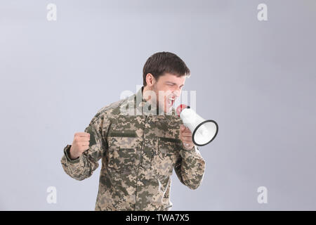 Angry military man shouting into megaphone on white background Stock ...