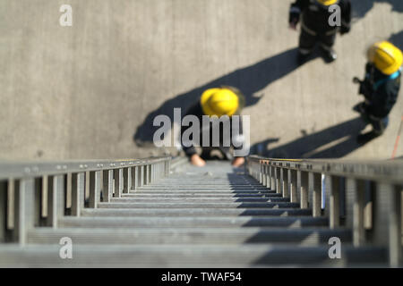 fire fighter climbing 13.5m ladder Stock Photo - Alamy