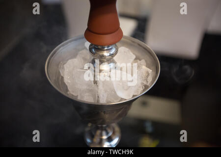 chunks of ice in ice cooler for shisha Stock Photo - Alamy