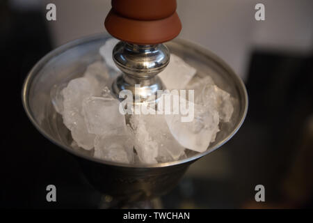 chunks of ice in ice cooler for shisha Stock Photo - Alamy