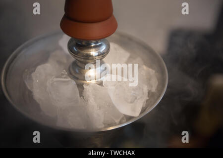 chunks of ice in ice cooler for shisha Stock Photo - Alamy