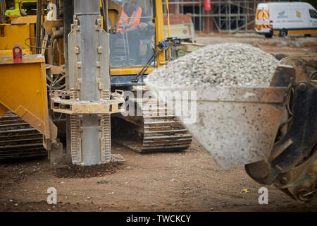 building house foundations with pile driver machine. reinforced ...