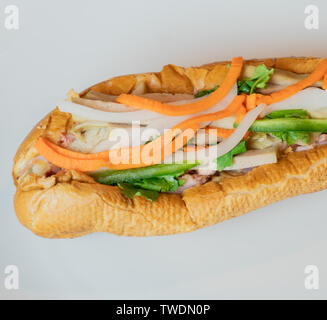 close-up of Banh Mi Vietnamese Meatballs on black plate on dark wood ...