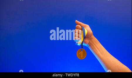1st position award Ribbon in hand, banner ?Success concept background ...