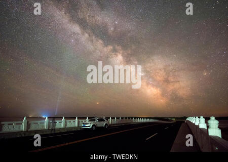 Galaxy in Xingkai Lake. Galaxy arch bridge, galactic on the lake, glow ...