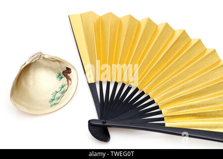 Gold folding fan on Japanese paper Stock Photo - Alamy