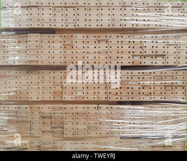 A pile of packed parts of a new furniture, various assembly furniture ...