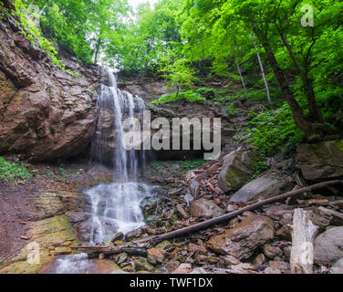 Two- tiered waterfall in mountain forest, drone view. Limunsudan Falls ...