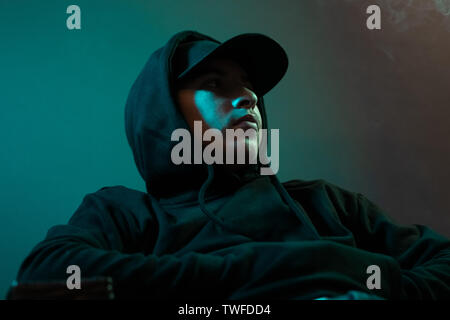 young cool rapper with black hoodie and face mask standing in front of ...