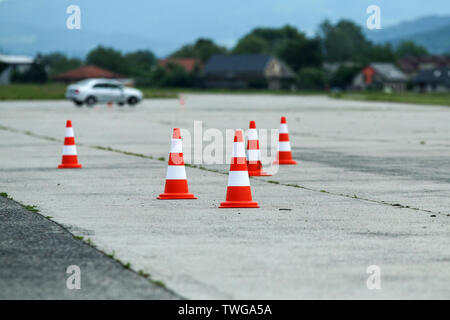 The detail of the traffic cones on the concrete area. They are used for ...