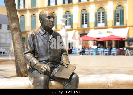 Bronze statue of Pablo Picasso, sitting on a bench, in Plaza de la ...