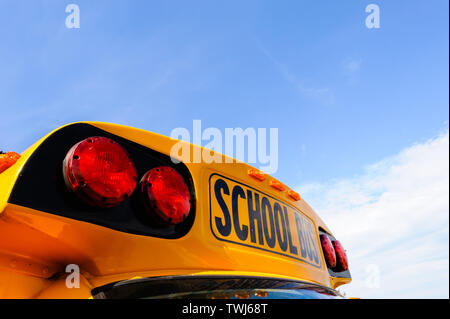 Top of a yellow school bus with lights and text. Back to school concept ...