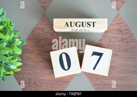 Date of August with leaf on diamond pattern table for background Stock ...