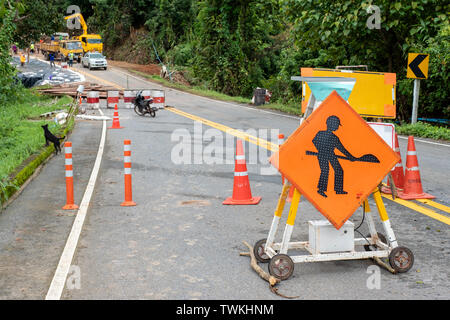 Traffic signs improve repairing on highway with landslide collapsed ...