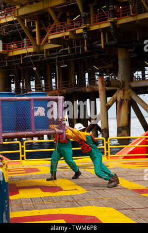offshore worker working on deck for loading cargo Stock Photo - Alamy