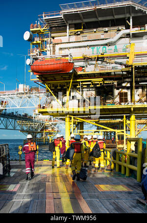 marine crew preparing oil platform personal to get ready for transfer ...