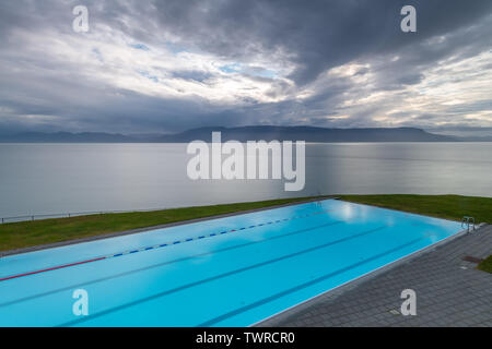 The swimming pool in Hofsós, Iceland, has a great view over ...