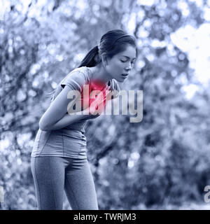 Nausea - nauseous and sick ill runner vomiting. Running woman feeling ...