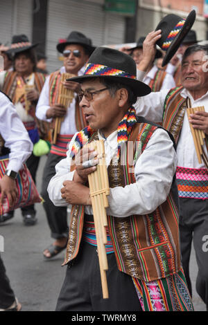 Kollasuyo man playing a siku (panpipe) at the Gran Poder Festival, La ...