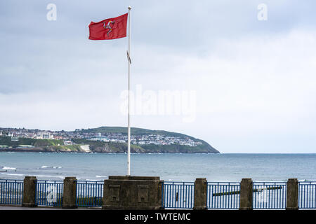 Red sign of the Triskelion the Manx emblem of three legs of man outside ...