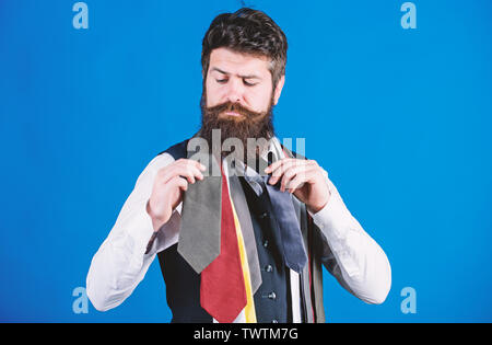 Guy with beard choosing necktie. Gentlemens guide. How to choose right ...