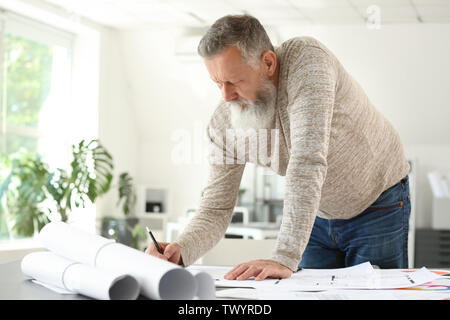 Aged male employee working in the office Stock Photo - Alamy