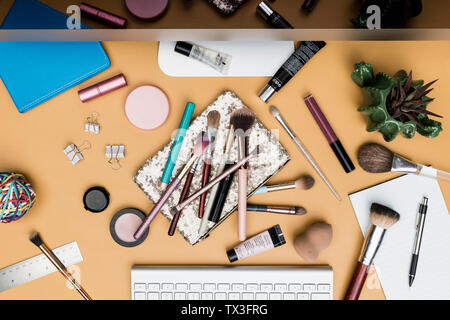 View from above makeup and makeup brushes on pink background - knolling ...