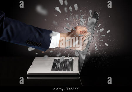 Strong male hand breaks laptop screen glasses Stock Photo - Alamy