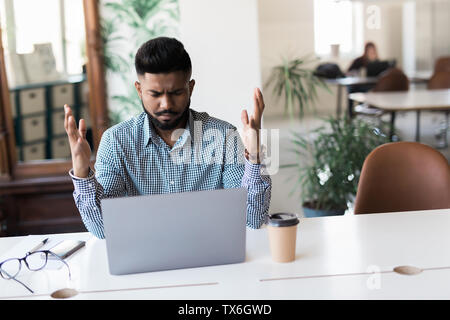 angry indian man screaming over grey background Stock Photo - Alamy