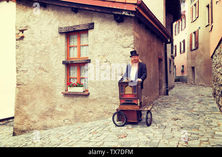 fulvous man with organ outdoors Stock Photo - Alamy