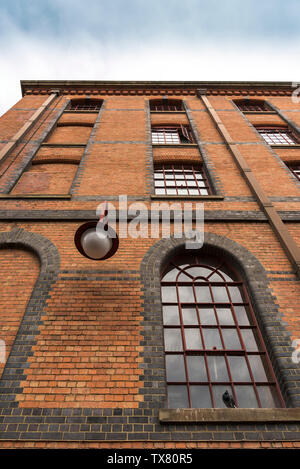 industrial red brick building with canal bridge and lock gatres new ...