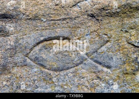 Christian fish symbol cave into the doorway of St Fillans Cave ...