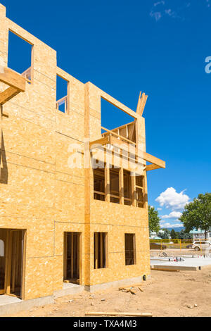 Low rise wooden framework of the building on concrete base Stock Photo ...