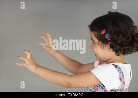 Close up of an Indian girl playing with toys Stock Photo - Alamy
