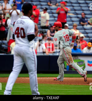 Philadelphia Phillies batter Laynce Nix (19) crosses the plate in front ...