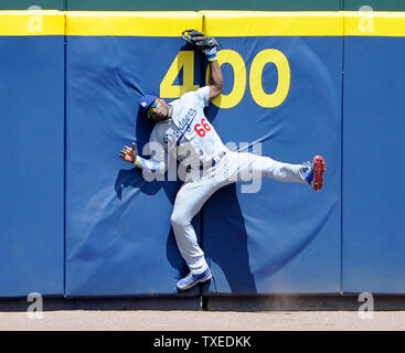 Atlanta Braves' Freddie Freeman, center, celebrates in the dugout after ...