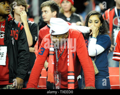 Fans react during the second half of an NFL football game between the ...