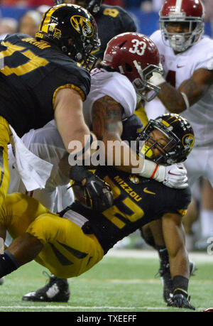 Missouri running back Russell Hansbrough, left, runs past Kentucky's ...