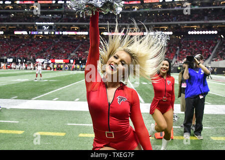 An Atlanta Falcons cheerleader performs during the first half of an NFL ...
