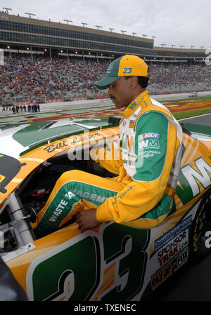 NASCAR driver Bill Lester climbs into is #23 Waste Management race car ...