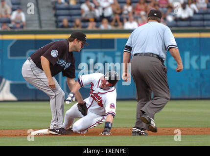 Toronto Blue Jays' Troy Glaus, left, walks off the field after his ...