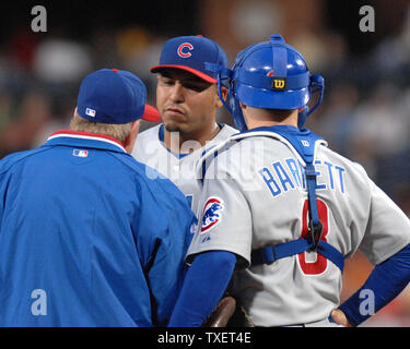 Chicago Cubs pitching coach Larry Rothschild talks to pitchers during ...