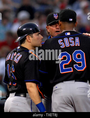 The Atlanta Braves pitching coach Rick Kranitz lights a cigar in ...