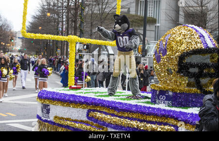 Harry the Husky leads the Husky Marching Band as they perform for fans ...