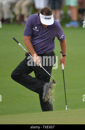 Phil Mickelson hits from the sand on the fifth hole during the final ...